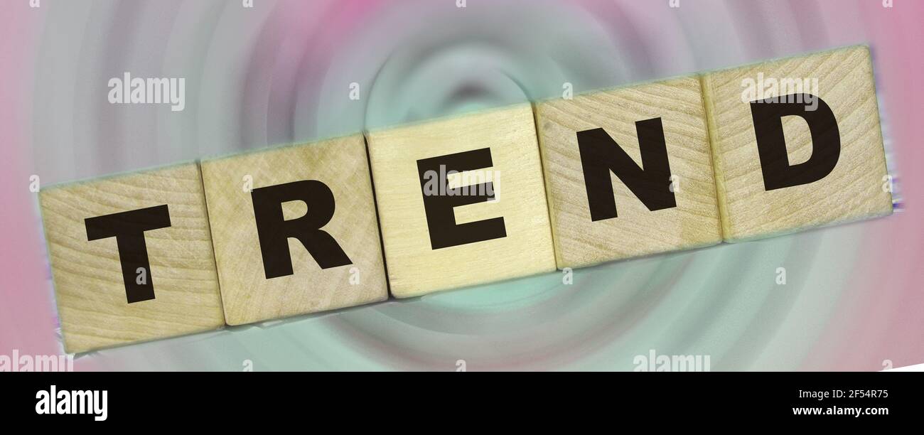 Trend word on cube blocks on relaxed ocean beach background. Business ...