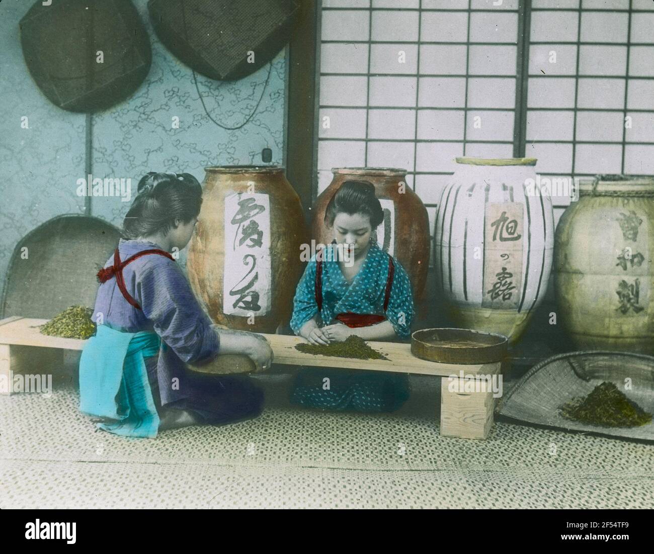 Japan. Tea making. Two women in Kimono while crushing tea leaves Stock ...
