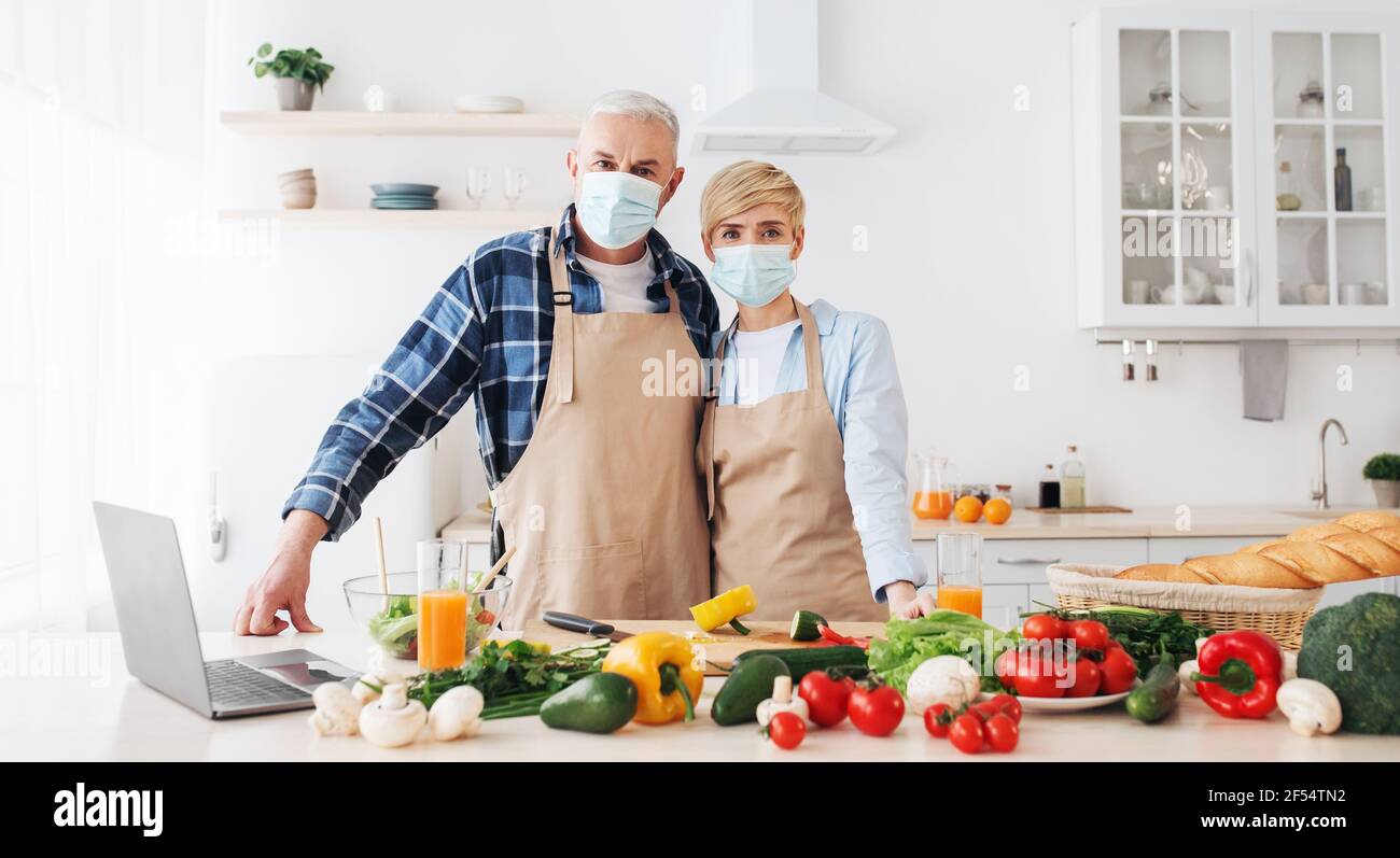 Covid-19 lockdown, self-isolate at home and cook food together Stock ...