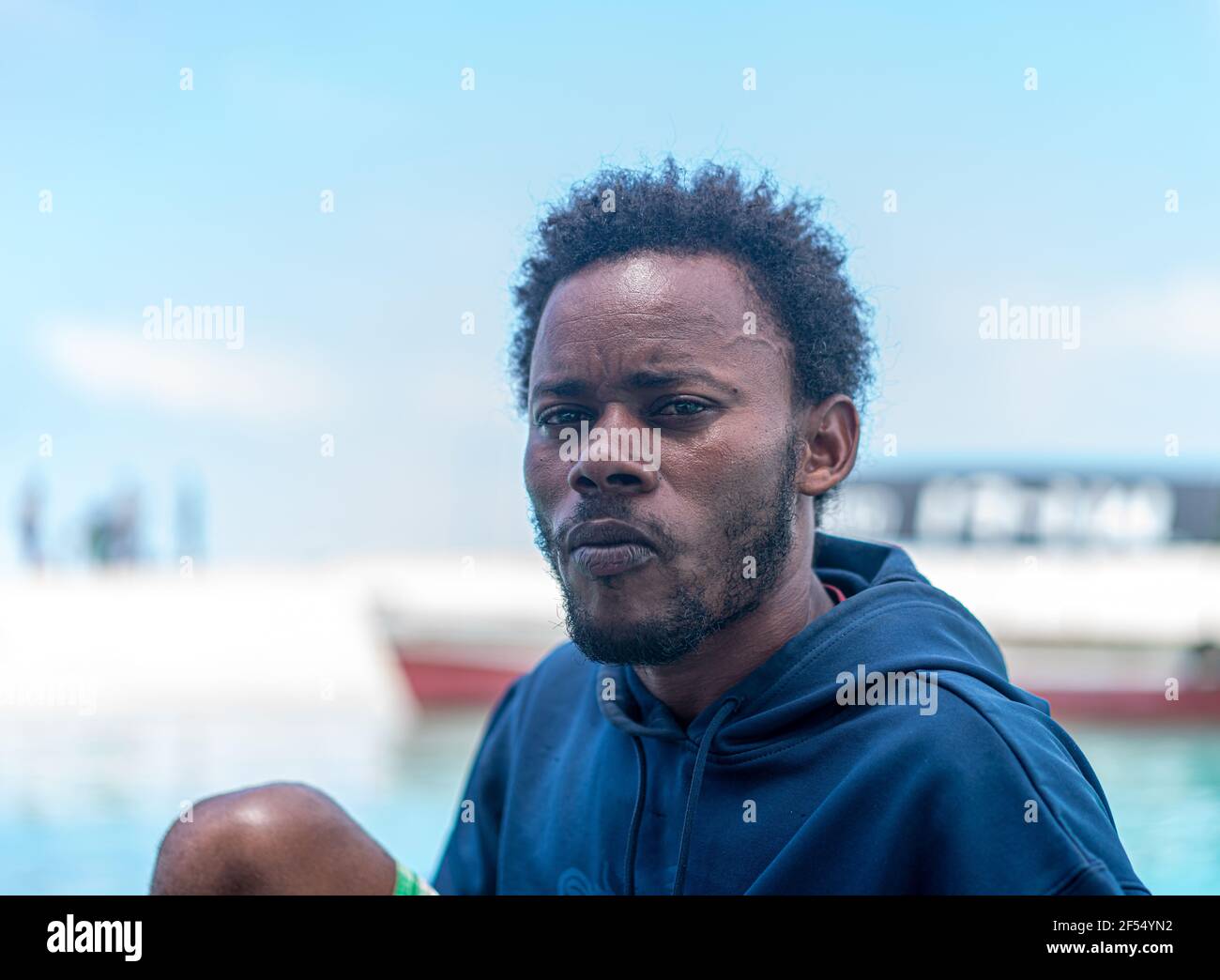 Young black man working on a coast Stock Photo - Alamy