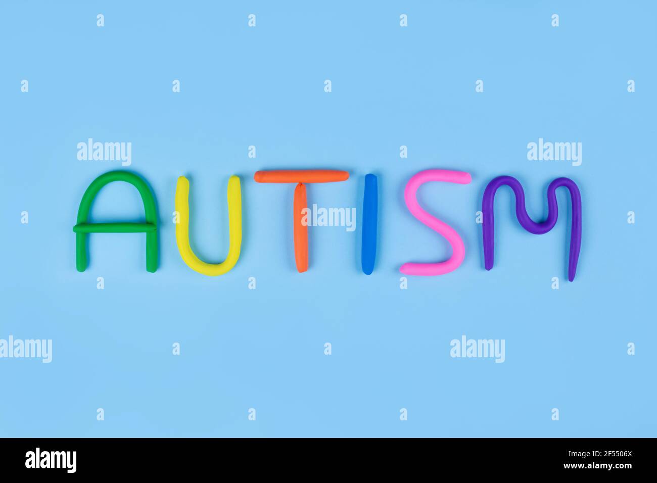 World Autism Awareness Day concept. Multicolored letters made of play ...