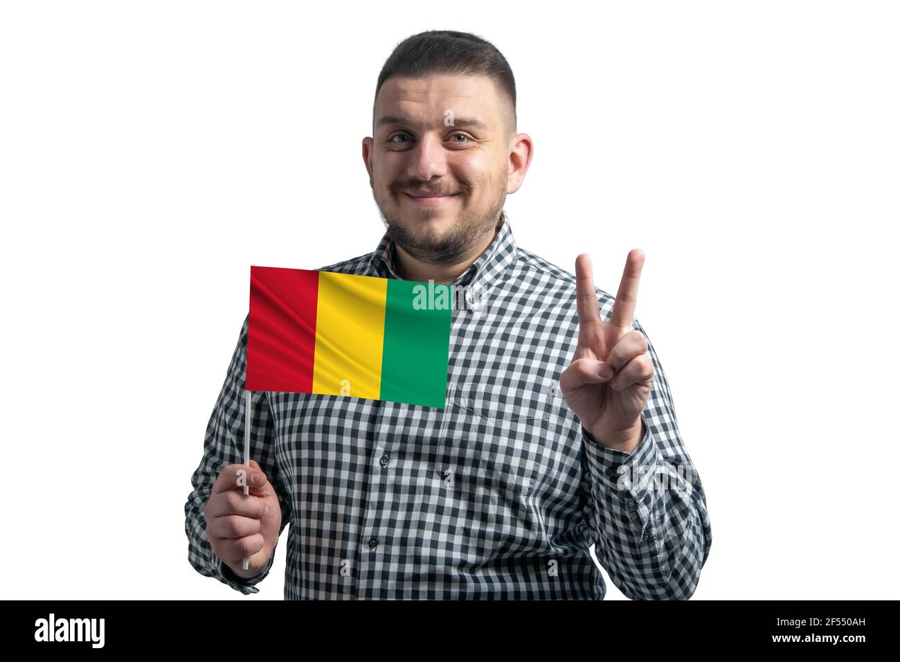 White guy holding a flag of Guinea and shows two fingers isolated on a ...