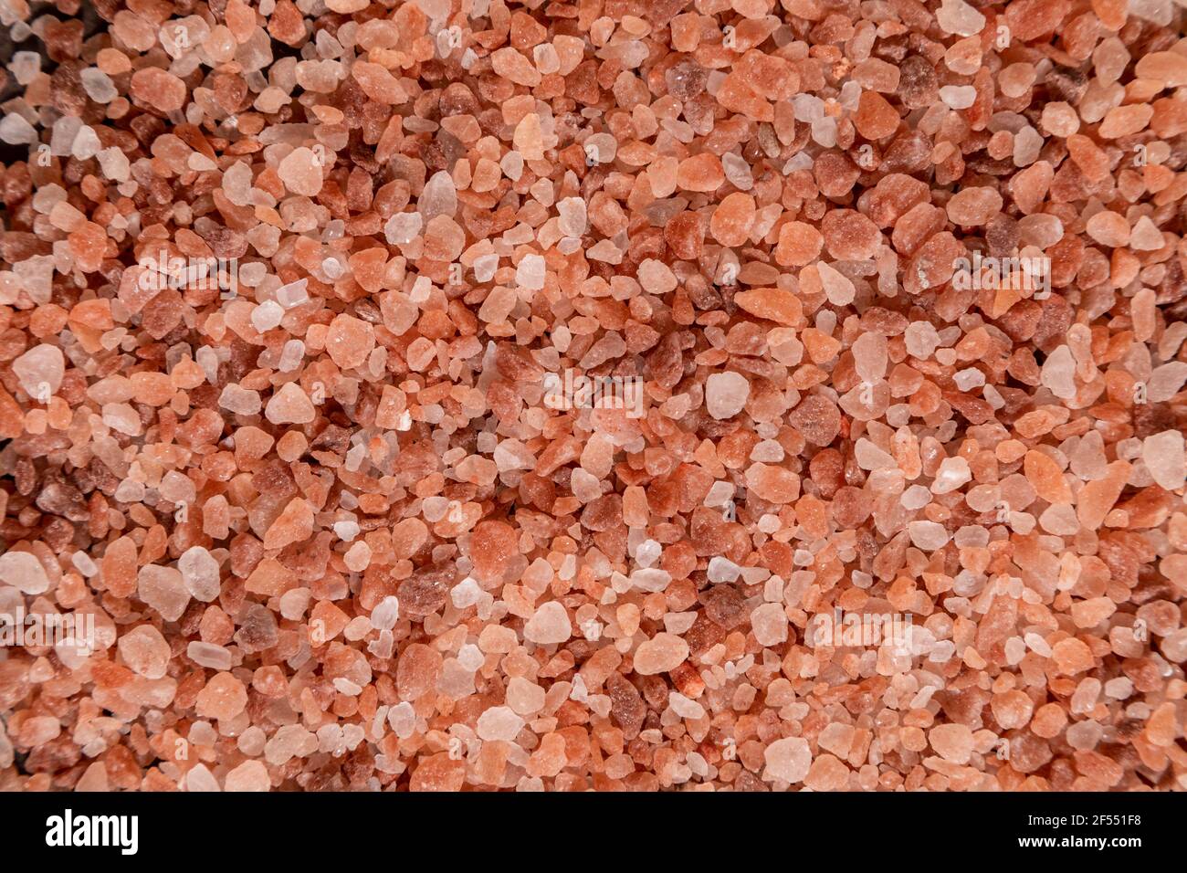 Himalayan pink salt on top of a rock. Selective focus Stock Photo - Alamy