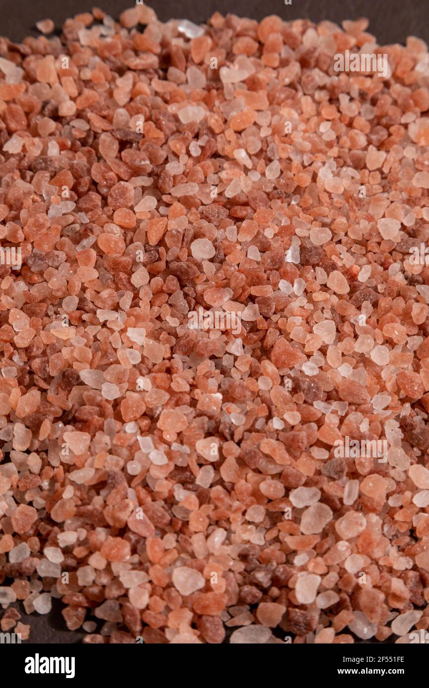 Himalayan pink salt on top of a rock. Selective focus Stock Photo - Alamy