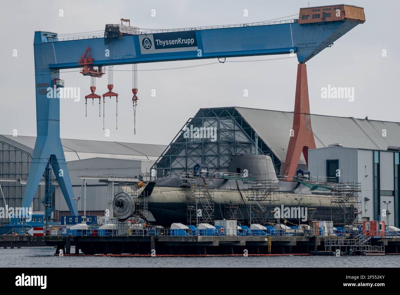 Kiel, Germany. 24th Mar, 2021. A submarine under construction lies in ...