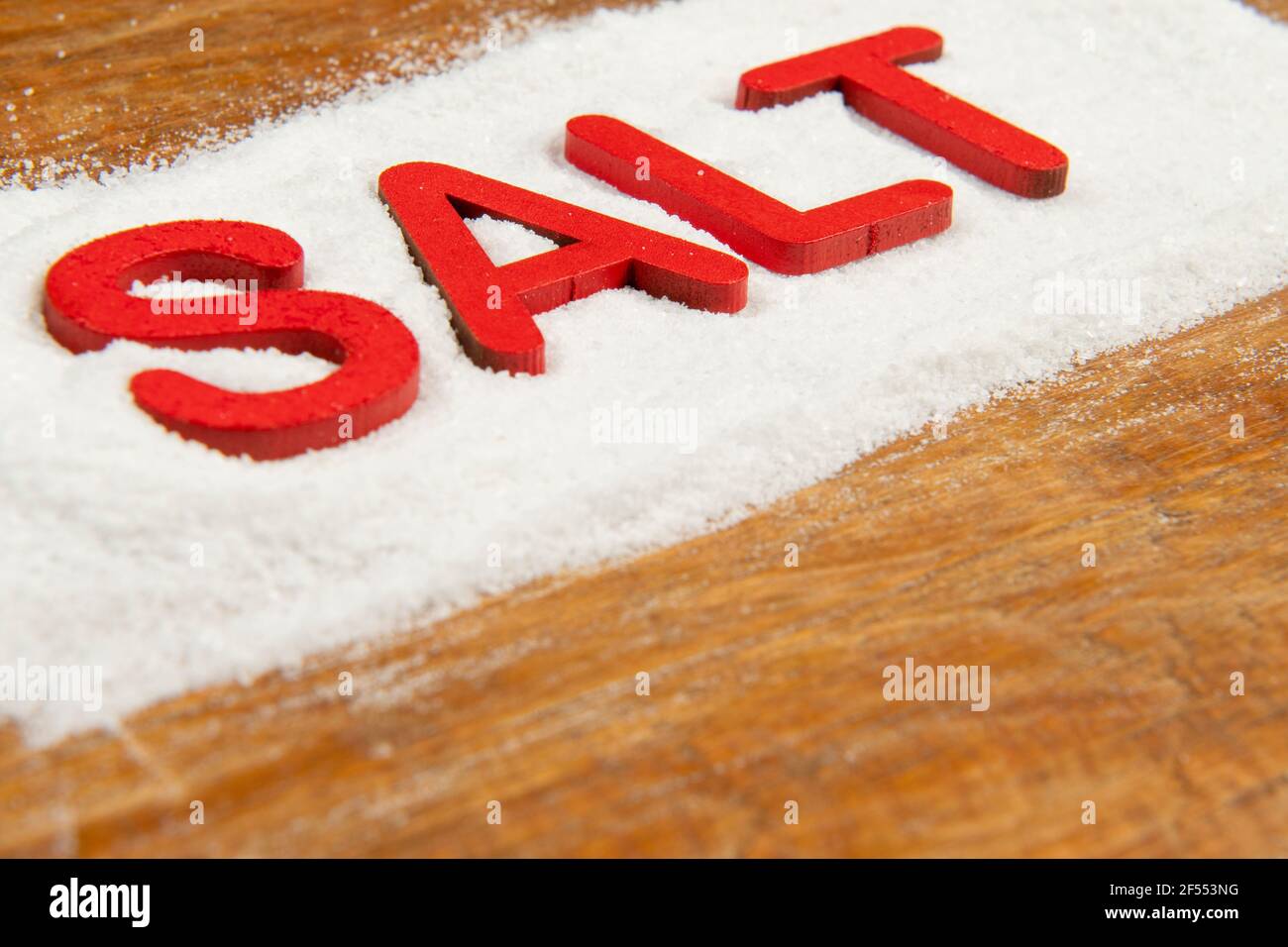 word salt written in red on the product formed a diagonal strip Stock ...