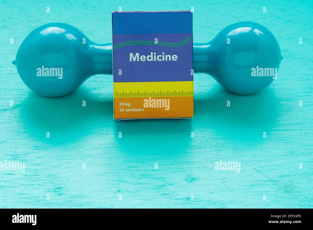 Medicine box and weight for physical exercise symbolizing mental ...