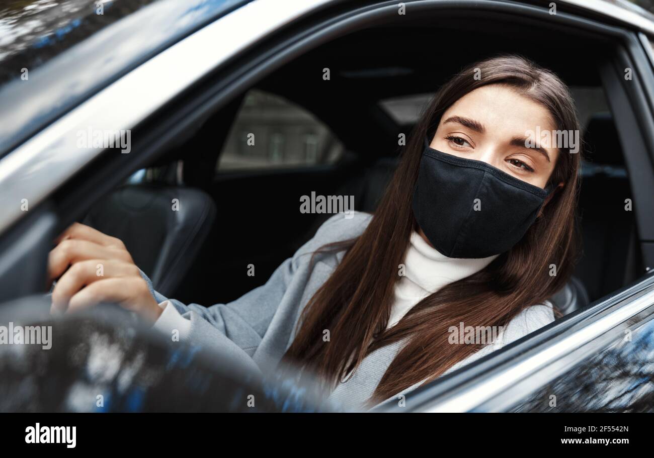 Covid-19 and business concept. Elegant businesswoman driver wearing ...