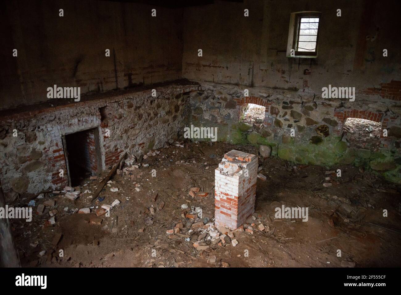 abandoned collapsed red brick building interior with lattice windows ...