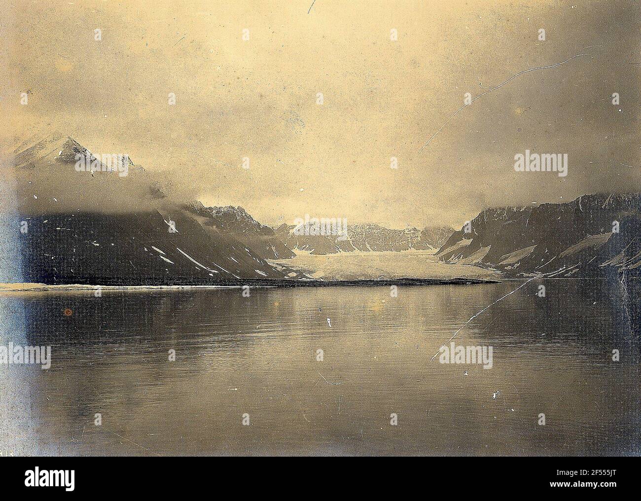 Spitzbergen. Crossbay. View over the bay and the glacier to a mountain ...