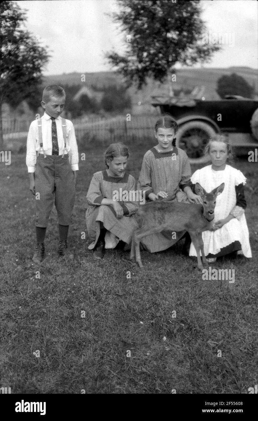 Children with deer Stock Photo - Alamy