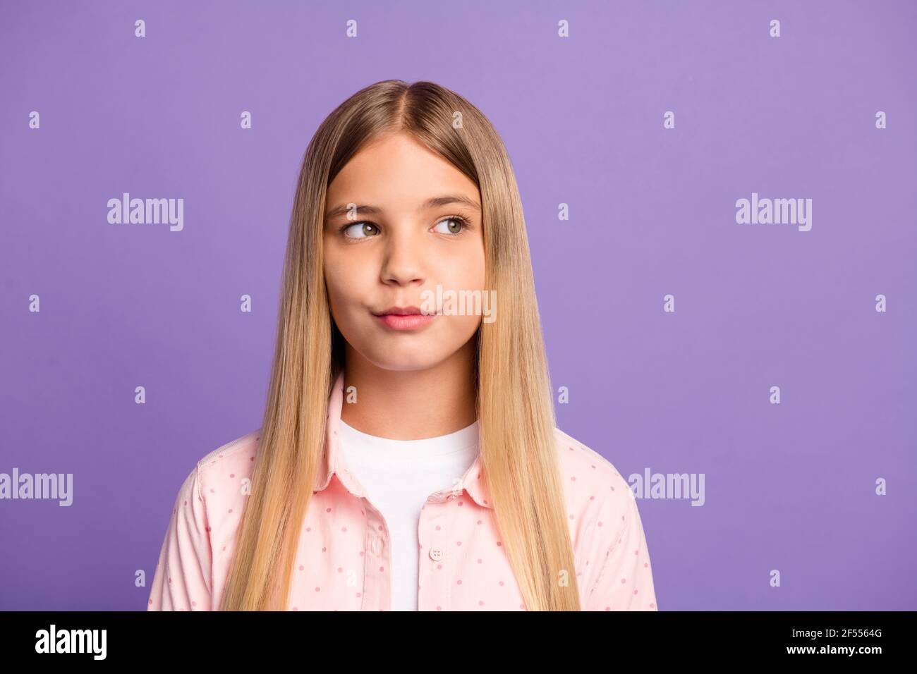 Portrait of cute long hairdo pretty girl look empty space wear pink ...