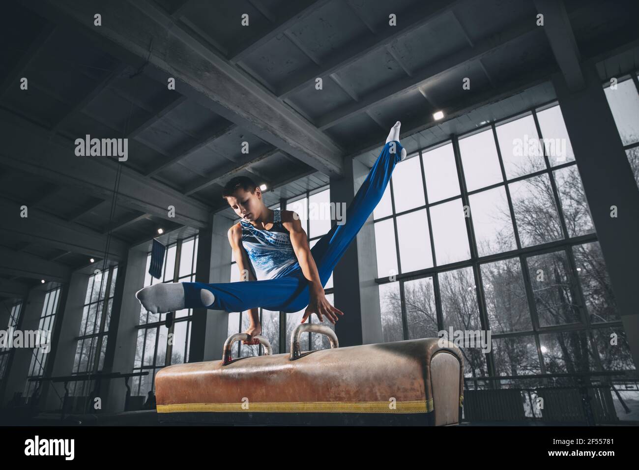 Little male gymnast training in gym, flexible and active. Caucasian fit ...