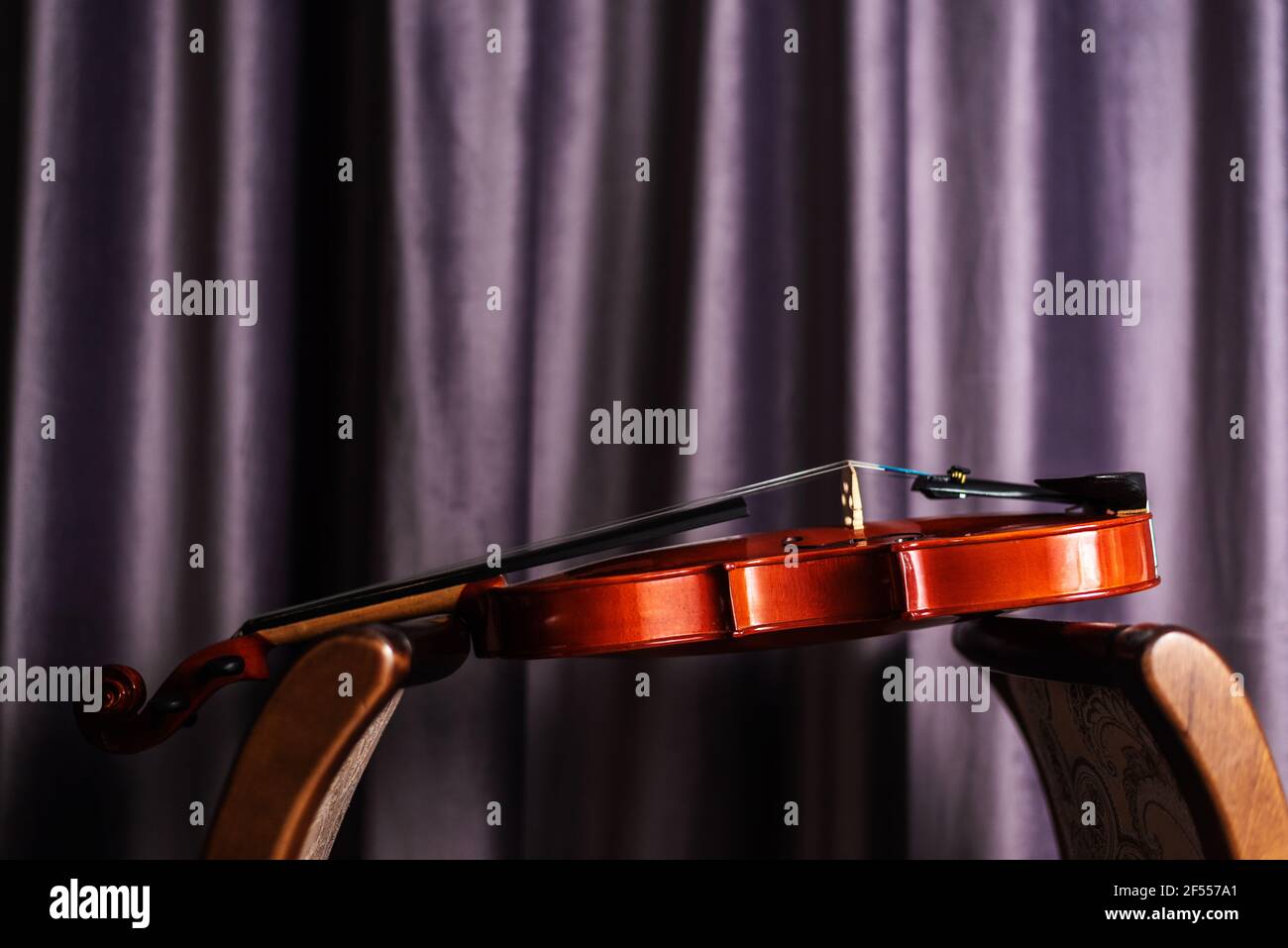 Wooden musical instrument laying on chairs Stock Photo - Alamy