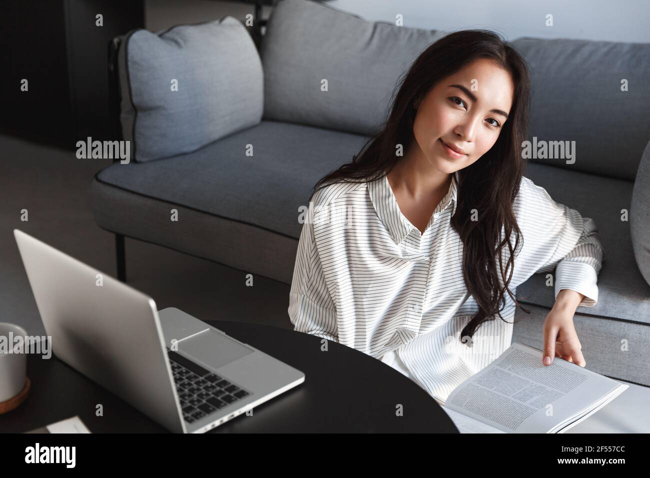 Portrait of beautiful asian female student studying remote from home ...