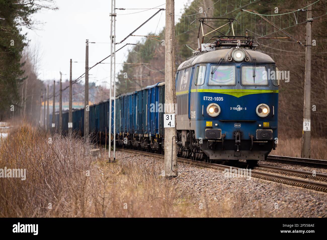 A freight train coming from a distance. Photo taken in low light ...