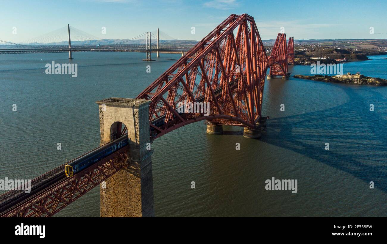 A view of a train traveling over the Forth Rail Bridge in South ...