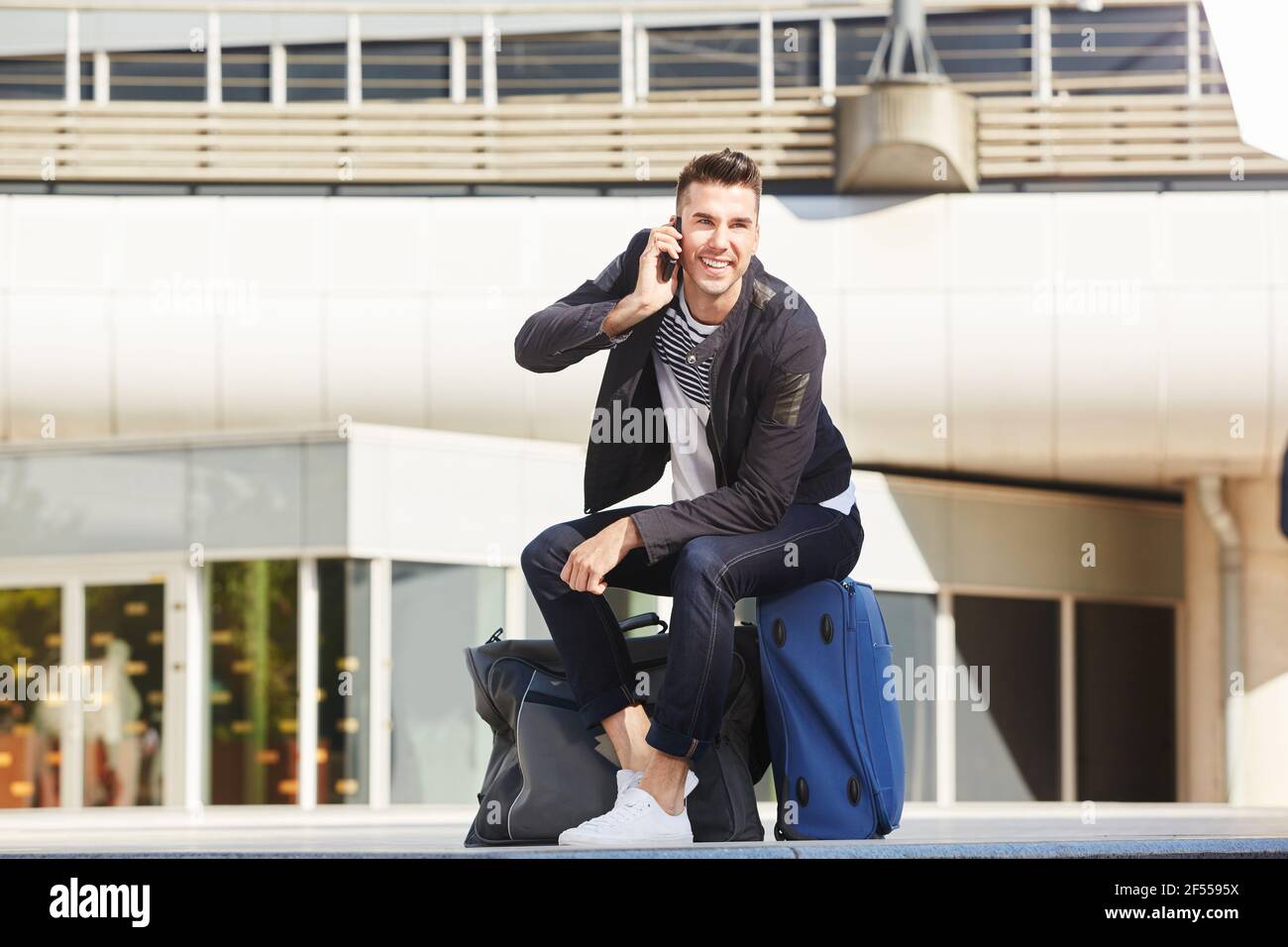 Person waiting with baggage outside hi-res stock photography and images ...