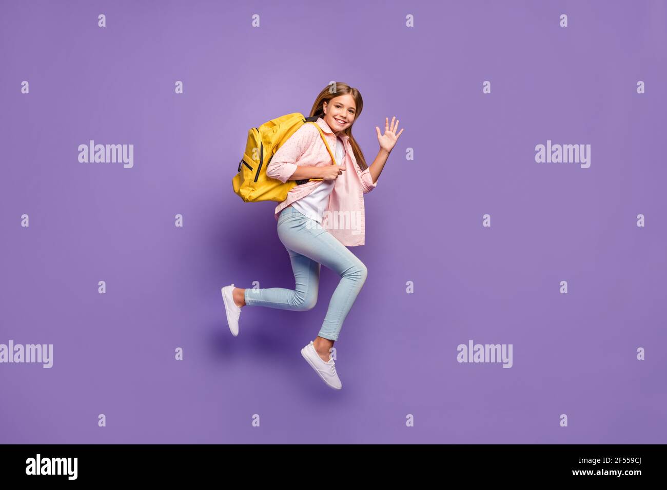 Full size profile photo of optimistic pretty girl jump wave hand wear ...