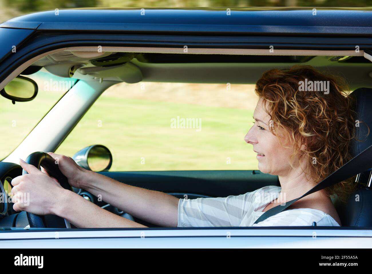 Side portrait of an older woman driving car Stock Photo - Alamy