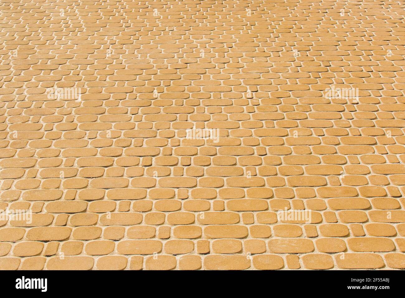 Light orange or yellow stone paving slabs floor tile urban texture ...