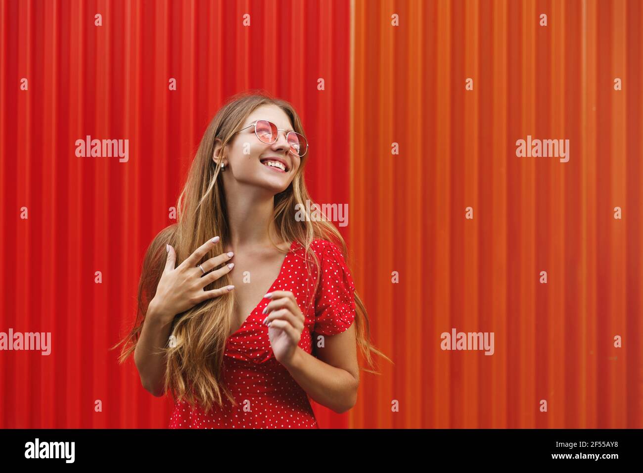 Tourism. Happy woman eating sweet ice cream outdoors and looking right ...