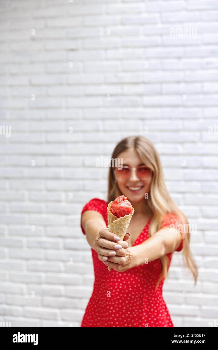 Woman giving ice cream hi-res stock photography and images - Alamy