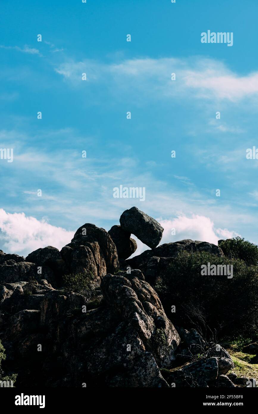 Natural view of huge rocks on a hill under a clear blue sky background ...