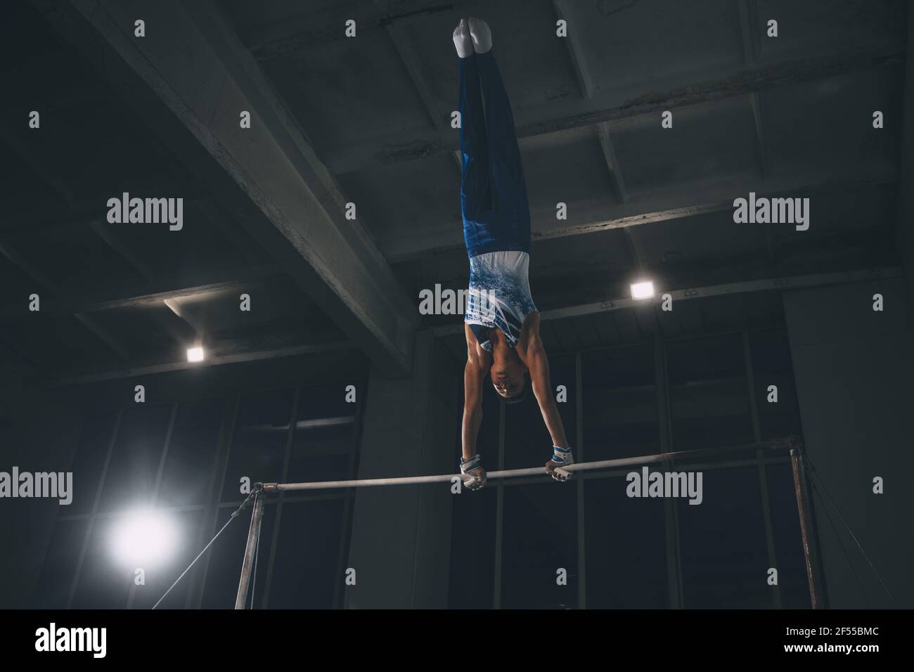 Little male gymnast training in gym, flexible and active. Caucasian fit ...