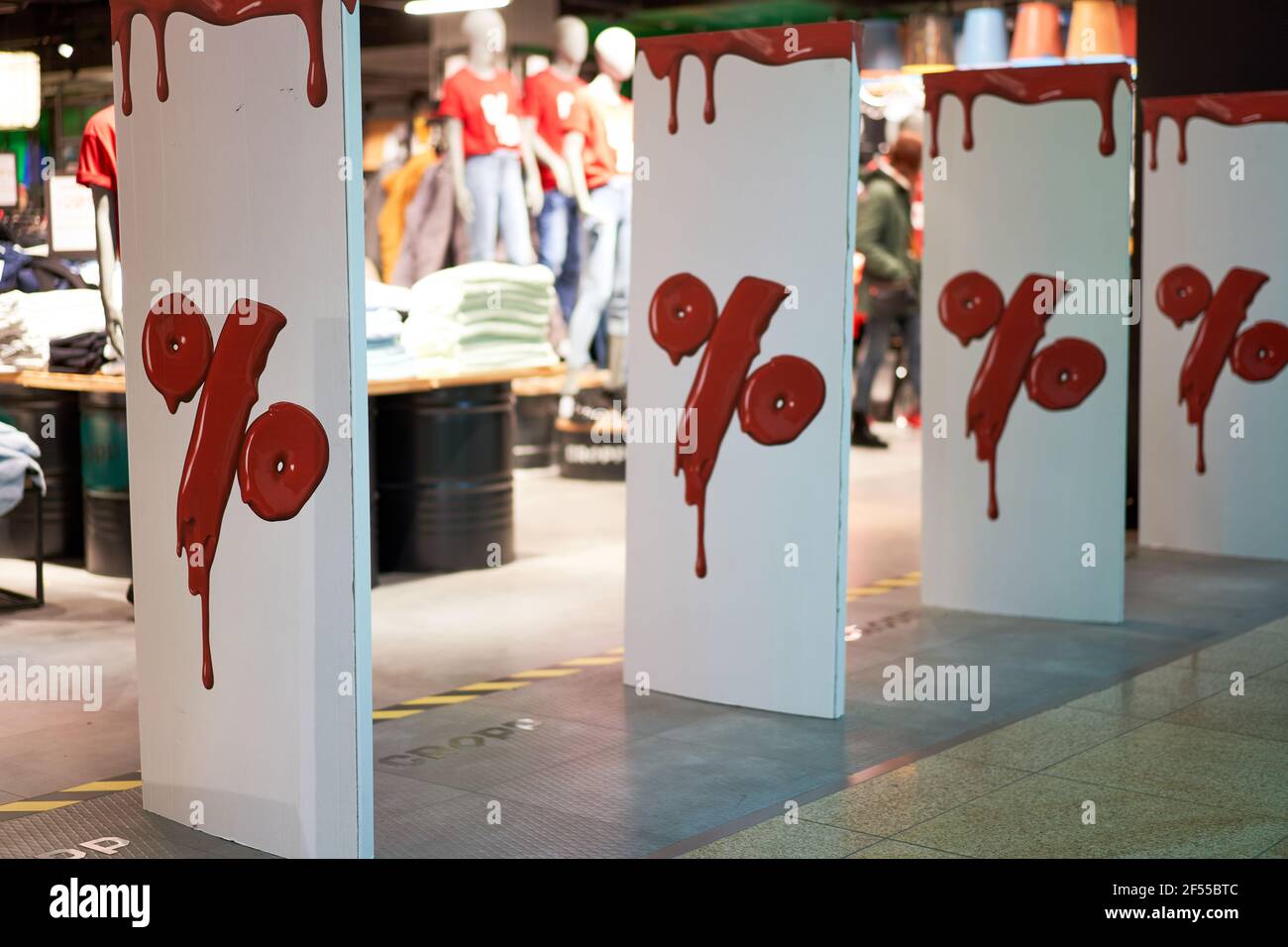 Percentage sign at the entrance to the store denoting seasonal ...
