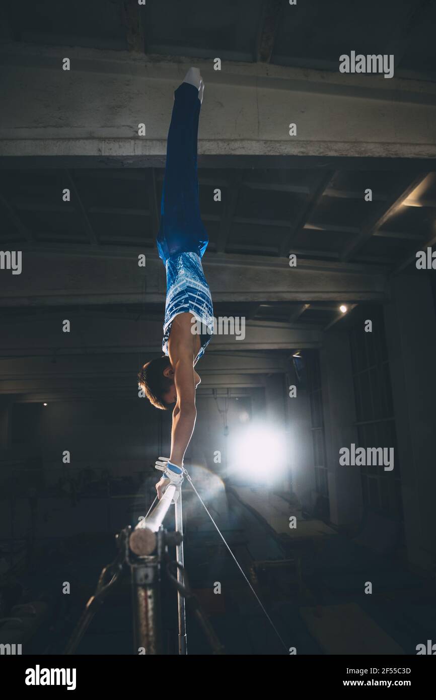 Little male gymnast training in gym, flexible and active. Caucasian fit ...