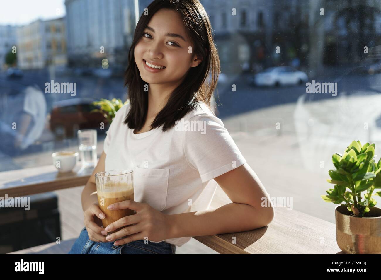City and young people, new generation concept. Asian smiling woman in ...