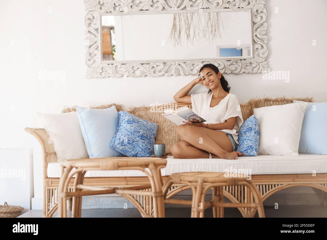 Wellbeing, relaxation and recreation concept. Charming woman sitting in ...