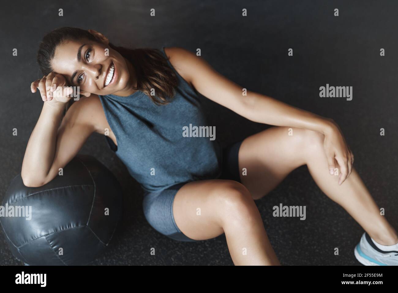 Phew, satisfied sportswoman take a breath, wipe sweat off forehead ...