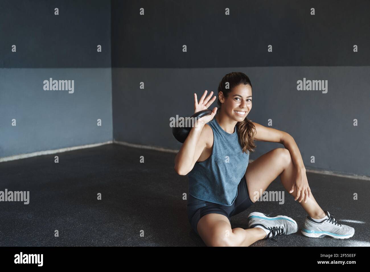 Happy female athlete satisfied herself after finish good workout ...