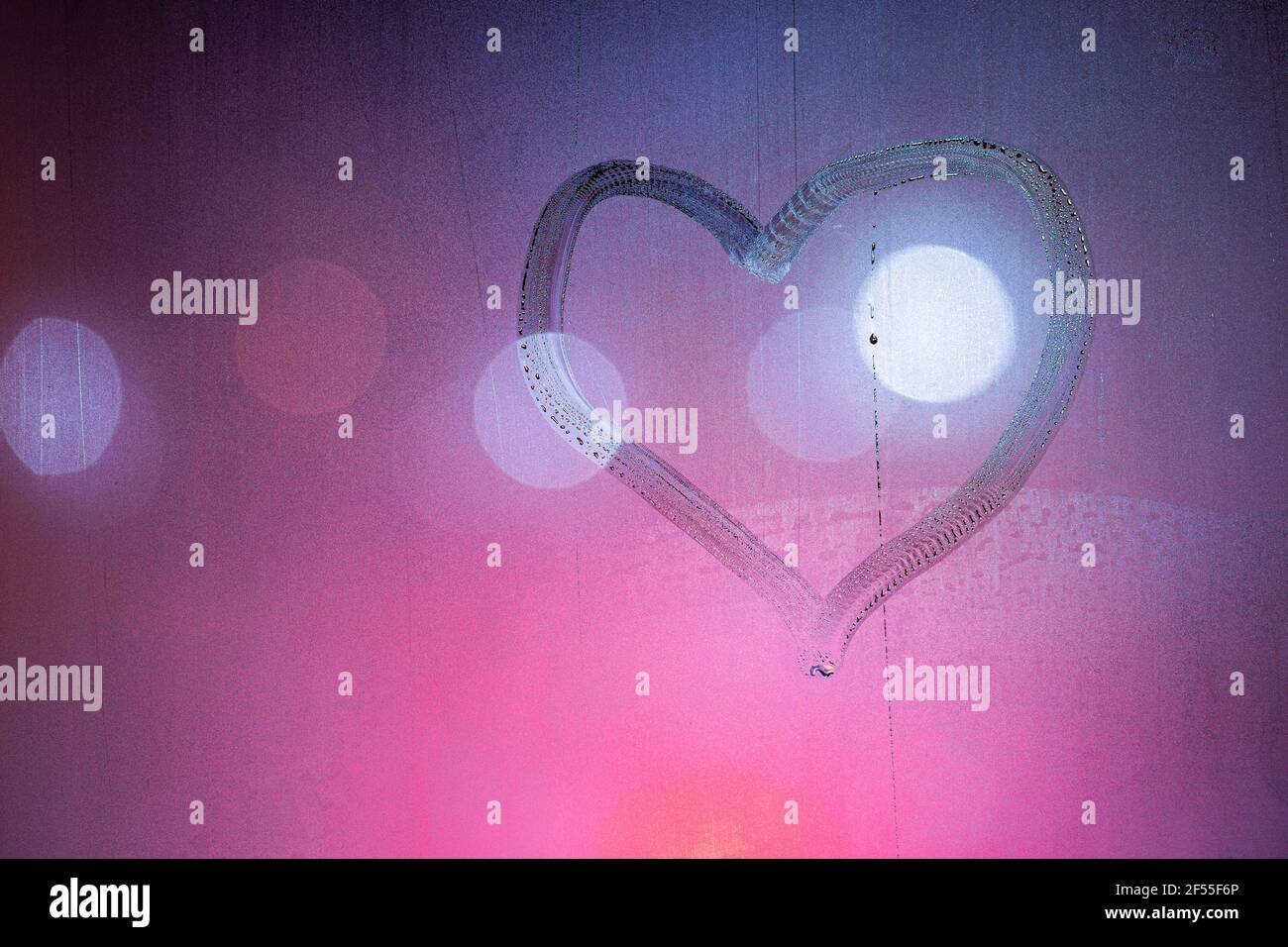 heart symbol hand drawn on wet night window glass in pink colors Stock ...