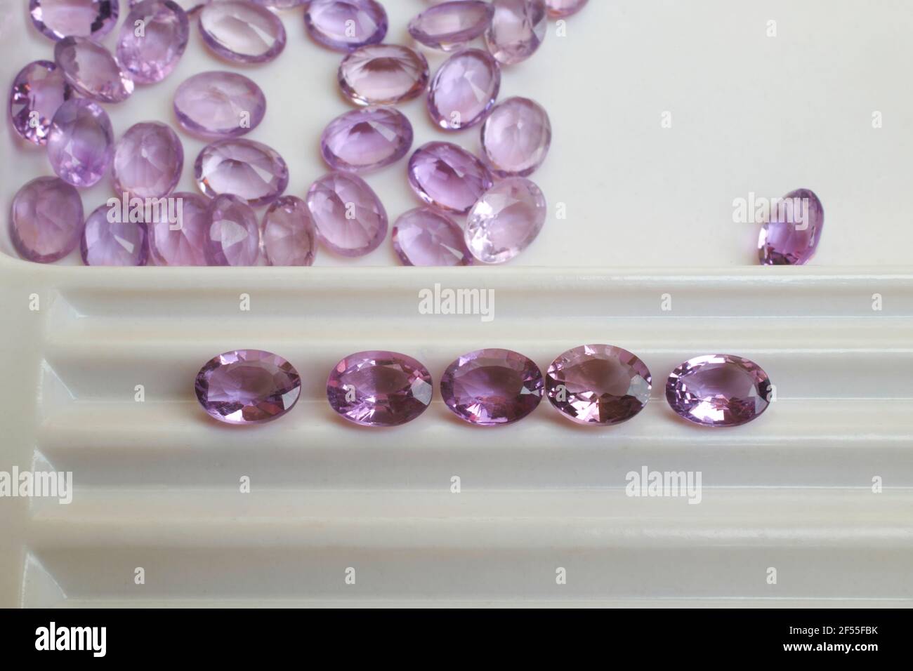 Amethyst brilliant cut gemstones on a sorting tray, Not Cut Out Stock ...