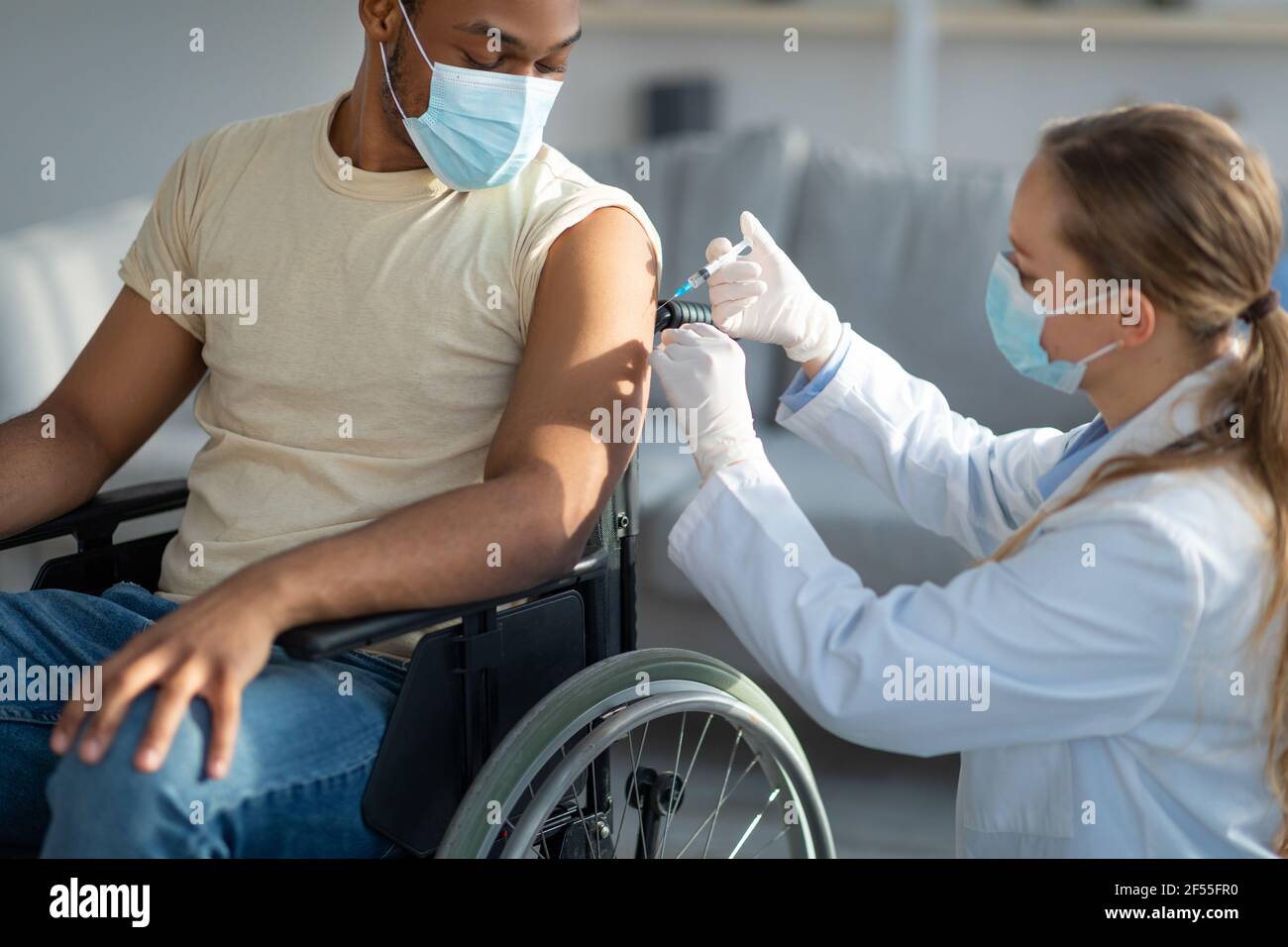 Covid-19 vaccination for homebound people. Doctor giving coronavirus ...
