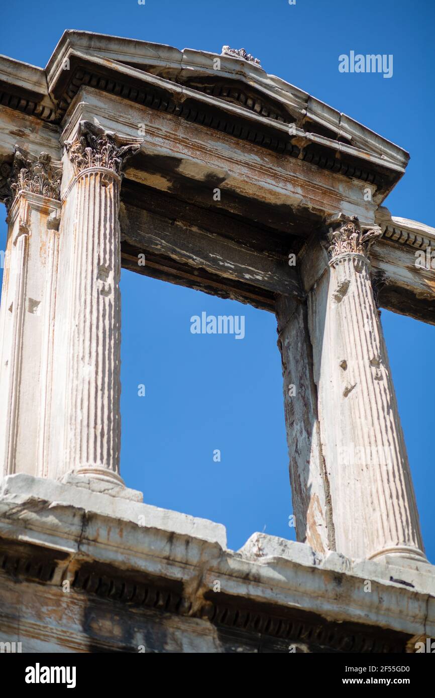 Vertical shot of the ancient Zeus temple gate on a blue sky background ...