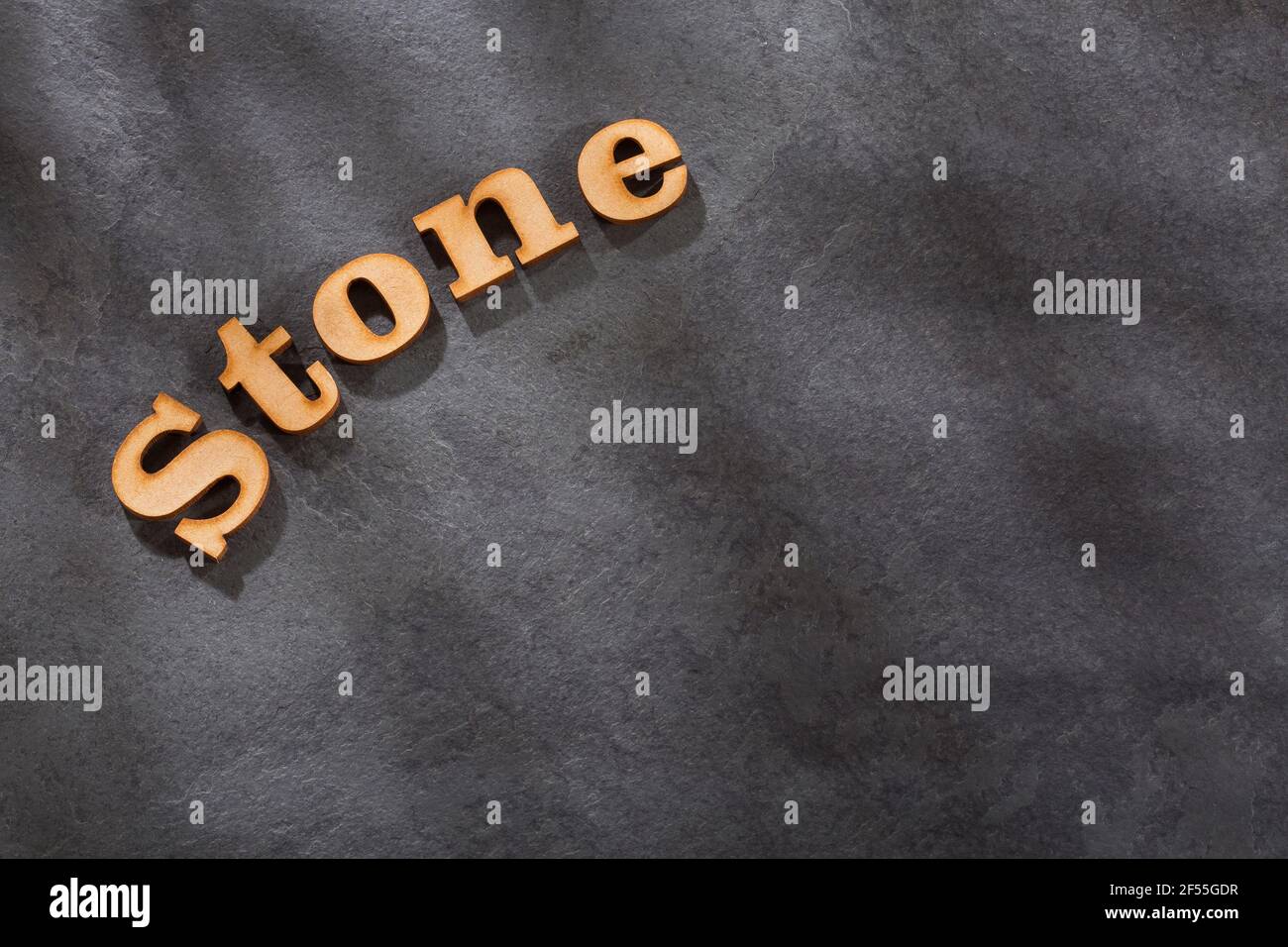 Stone word in wooden letters Stock Photo - Alamy