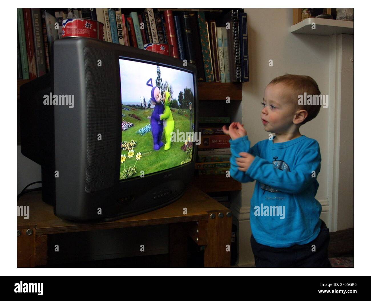 Oliver Bennett watching Tv with his son Bruno.pic David Sandison 30/10 ...