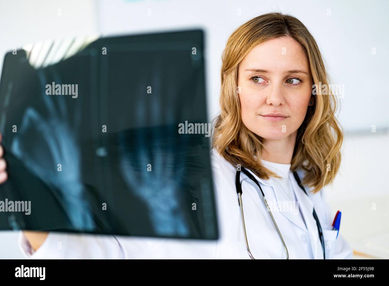 Female radiologist examining X-ray in medical clinic Stock Photo - Alamy