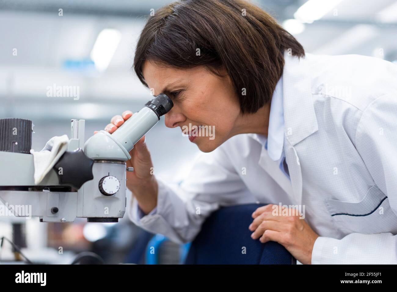 Scientists working using microscope hi-res stock photography and images ...