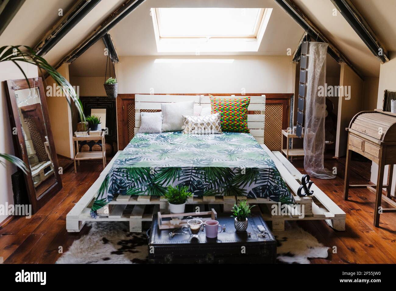 Beautiful attic bedroom with modern decoration Stock Photo - Alamy