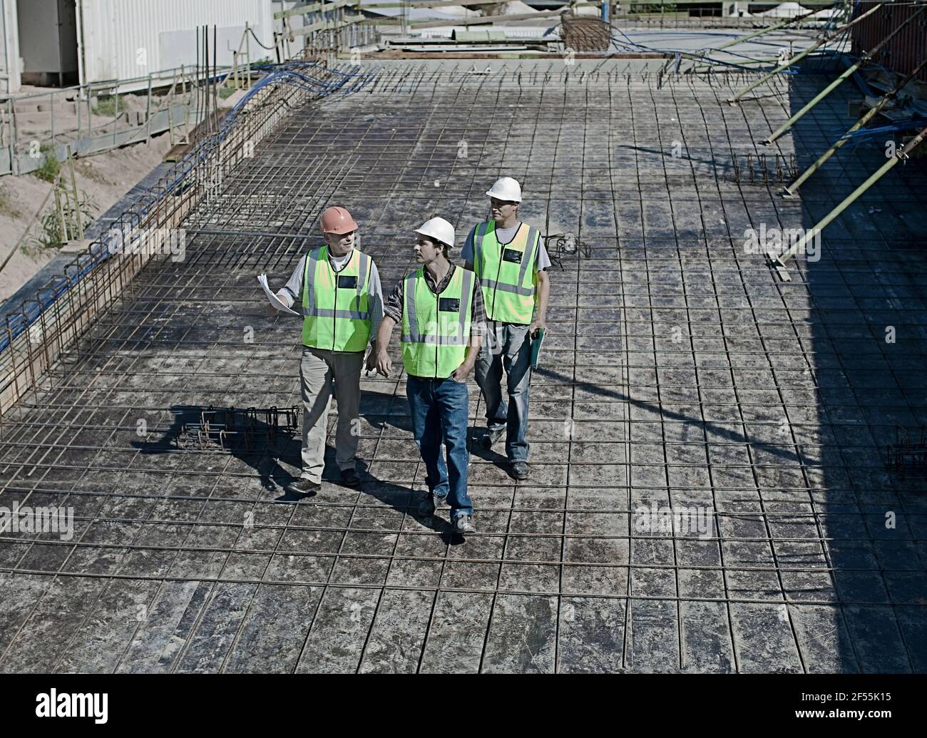 Construction workers talking construction site hi-res stock photography ...