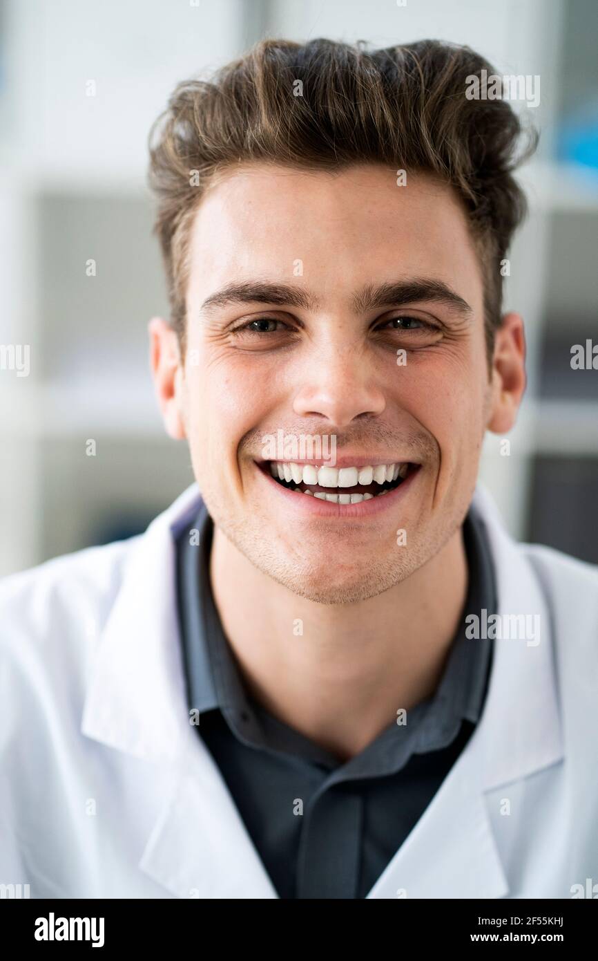 Male scientist smiling in laboratory Stock Photo - Alamy