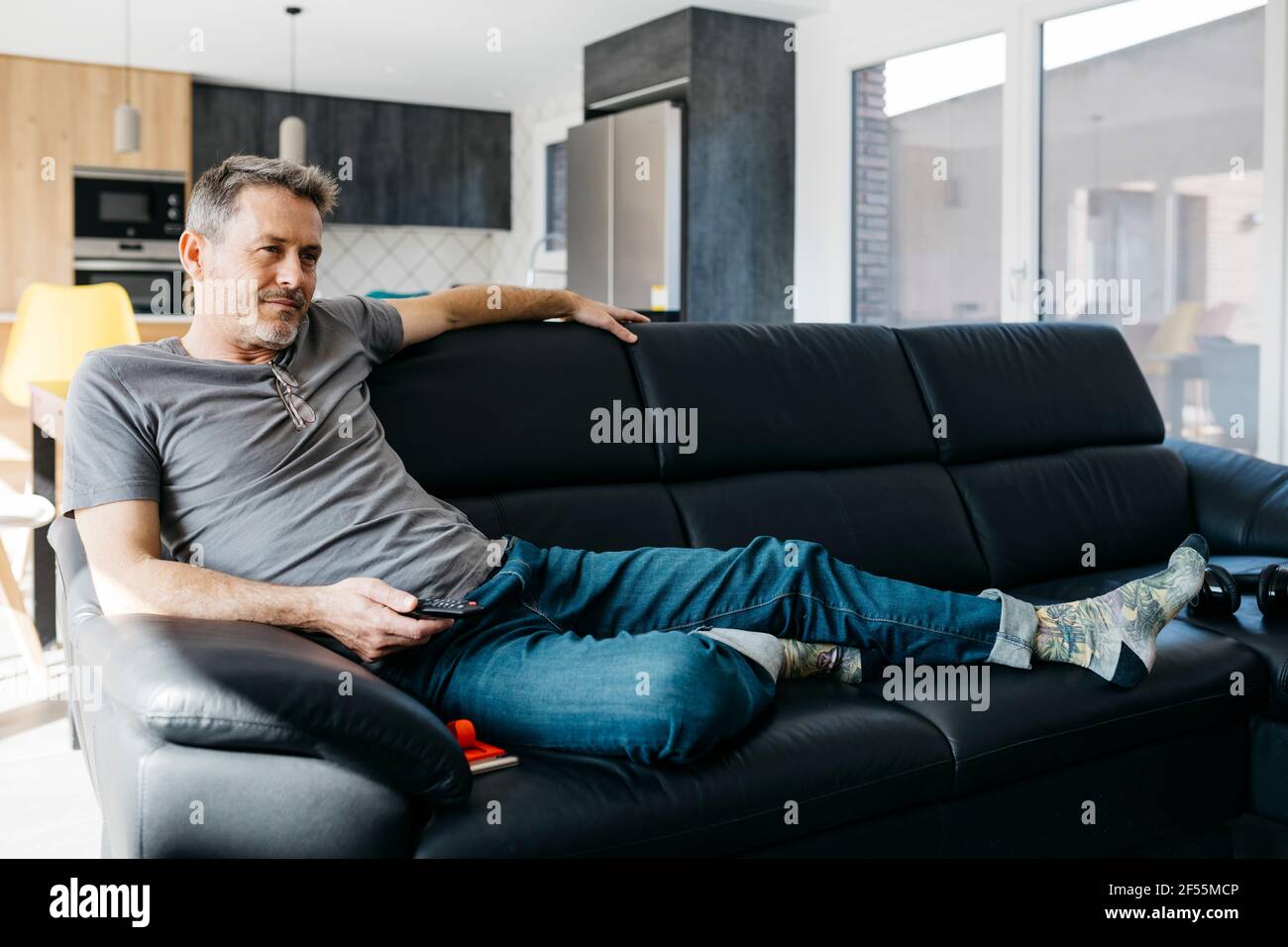Remote control sitting hi-res stock photography and images - Alamy