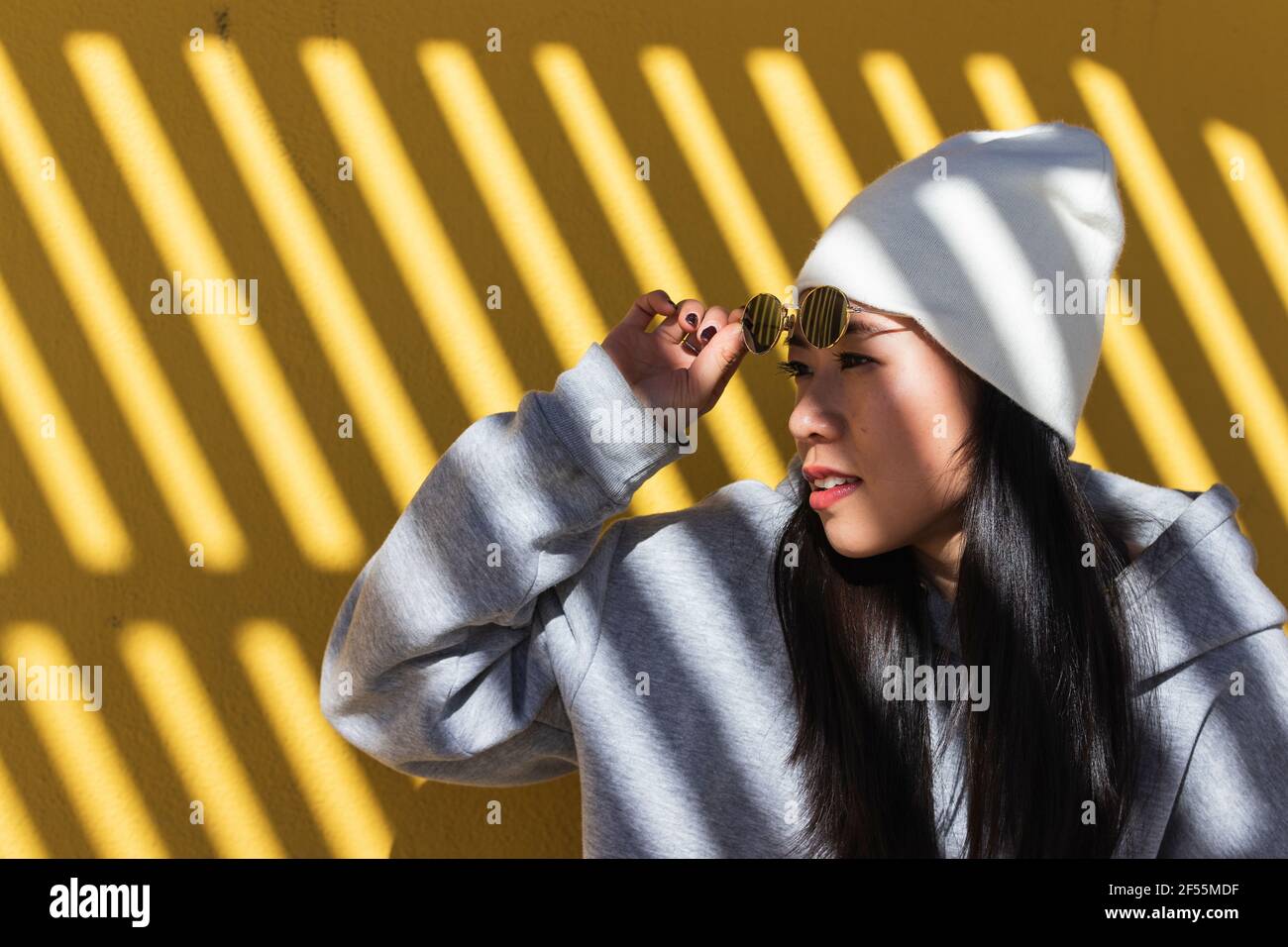 Woman removing her glasses hi-res stock photography and images - Alamy