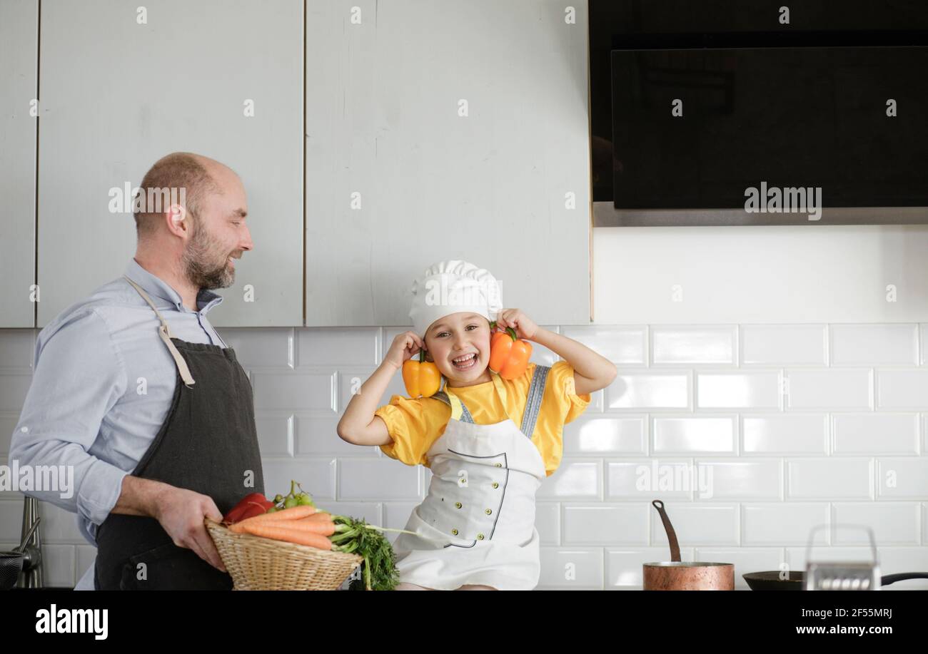 Playful daughter playing vegetable hi-res stock photography and images ...