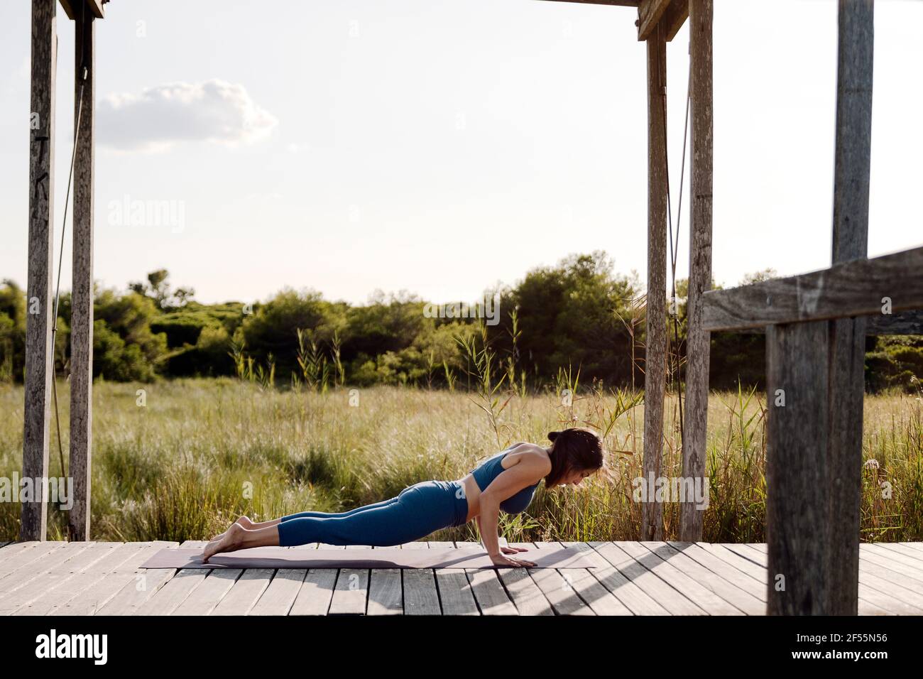 Woman doing yoga at gazebo Stock Photo - Alamy